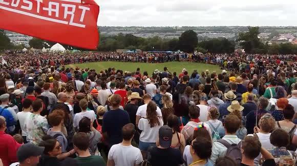 Thousands of festival-goers gather to form the world's largest peace ...