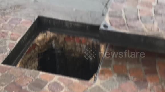 Manhole cover "explodes" during UK flash floods - Buy, Sell or Upload ...
