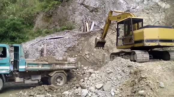 Eight-year-old girl expertly operating backhoe digger on construction ...
