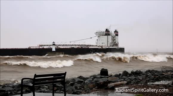 Thousand foot Laker ship heads into Lake Superior winter storm with ...