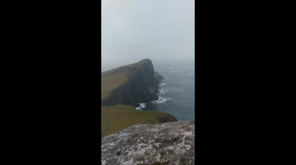 Waterfall flowing backwards in high winds at Neist Point on Isle of ...