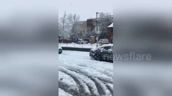 Man slips and falls as he pushes a car in the snow - Buy, Sell or ...