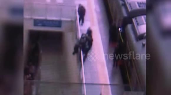 Police grabs man jumping off guardrails at train station - Buy, Sell or ...
