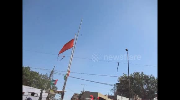 Political and sectarian flags on buildings mark and stake territory ...