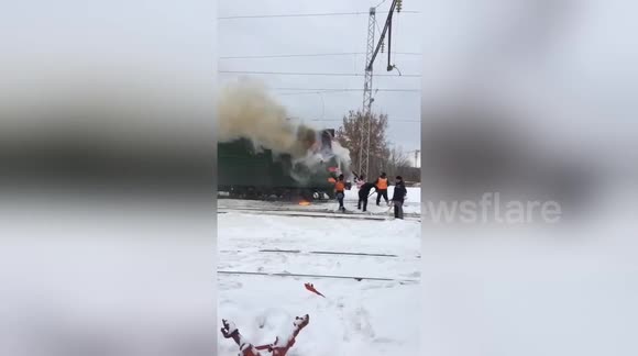 Only in Russia: Railway staff douse train blaze with snow - Buy, Sell ...