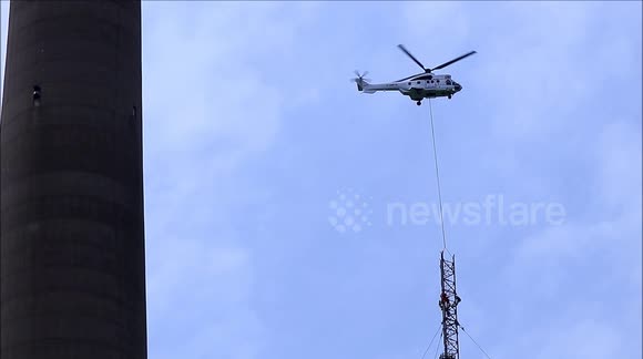 Scared of heights? This video of workers atop soaring tower may make ...