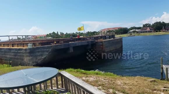 Barge smashes into wooden dock in Perdido Key, Florida - Buy, Sell or ...