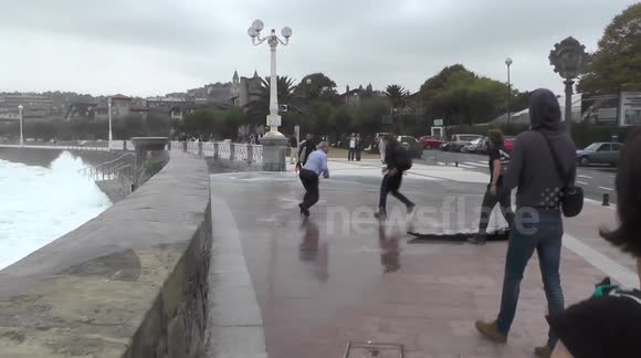 Huge wave knocks man to the ground in San Sebastian, Spain - Buy, Sell ...