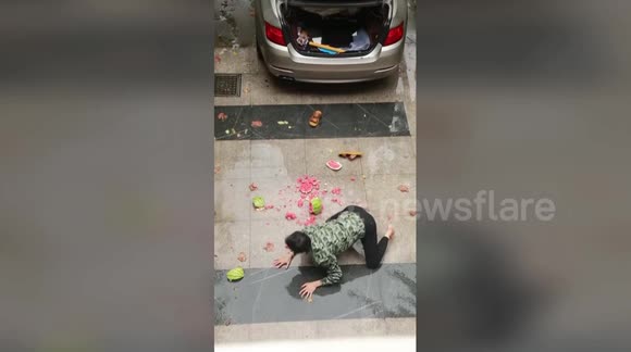 Slapstick scene as man slips up and smashes watermelon - Buy, Sell or ...