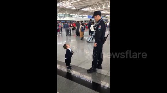 Cute boy just wants a hug from airport security guard - Buy, Sell or ...
