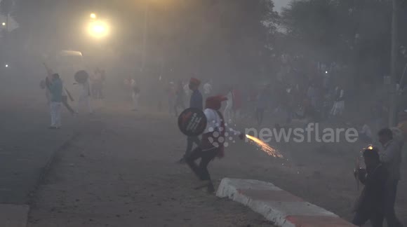 Indian villagers hurl homemade firecrackers at each other in mock war ...