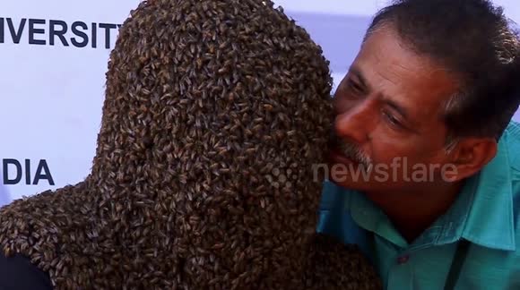 Indian man sets world record for wearing 60,000 bees on his face for ...