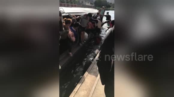 Woman rescued after stepping off boat and falling into canal inches ...