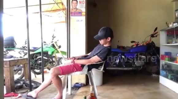 Hilarious footage shows sleepy man falling off chair in Philippines ...