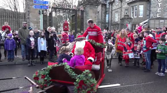 Reindeer pull santa's sleigh through streets for Dunkeld Santa Day 2018 ...