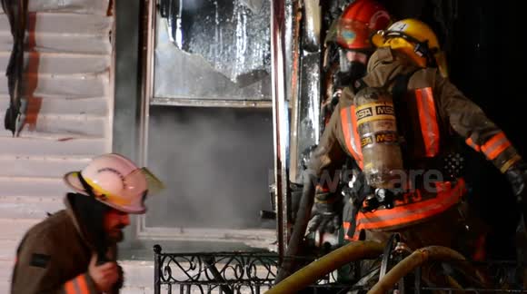Fire fighters at the aftermath of a house fire in Fort Erie, Ontario ...