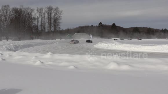 Cars hold rally-style race on frozen ice track in Canadian countryside ...