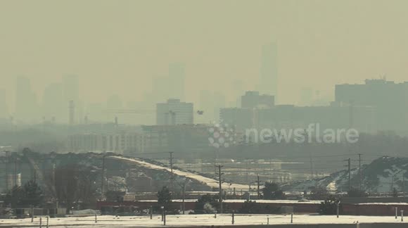 Toronto blanketed by a rare winter smog event this morning creating a ...