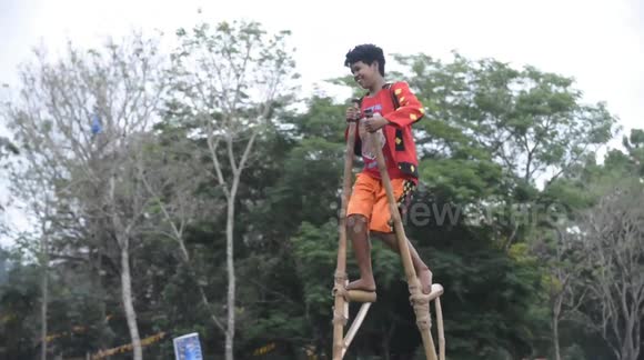 Bizarre race on stilts reaches new heights at hill tribe sports day in ...