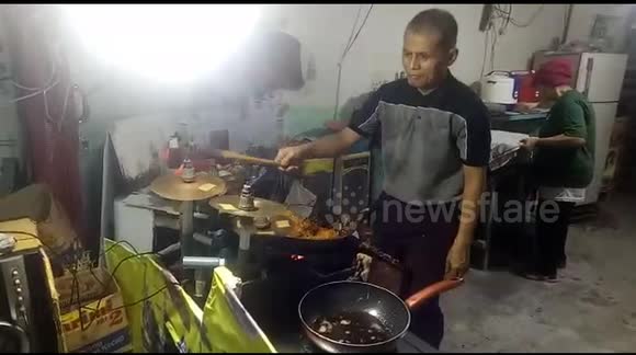 Cook drums out some music while frying up his rice - Buy, Sell or ...