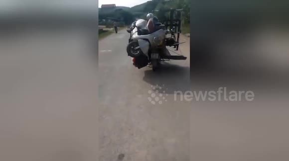 Little overloaded? Man carries motorcycle on top of his motorcycle ...