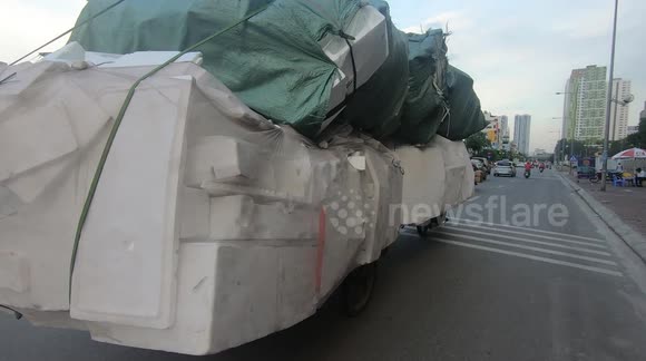 Motorcycle carries ridiculously overloaded foam boxes! Crazy motorcycle ...