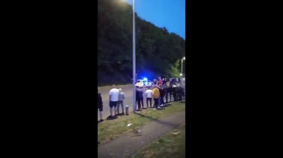 Police filmed 'accelerating quickly' after being egged on by spectators ...