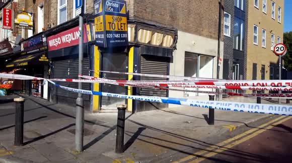 Police cordon off street in north London after shooting leaves woman in critical condition - Buy ...