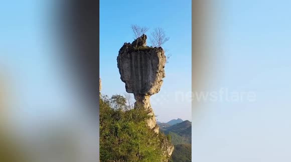 Top-heavy rock in China still standing after thousands of years - Buy ...