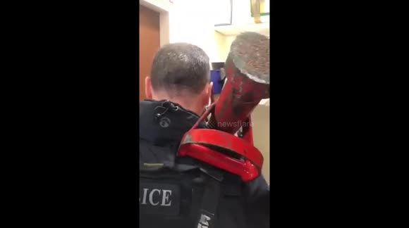 UK police officers use battering ram to break colleague out of locked ...