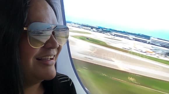 Bored Filipino fakes flying away by posing in front of TV during ...