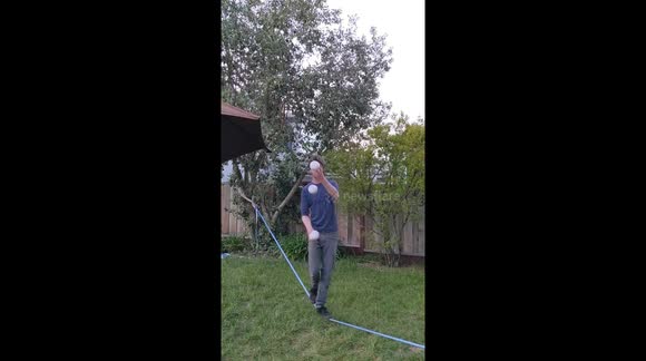 California juggler performs 'behind the neck' tricks while balancing on ...