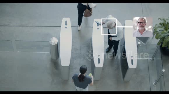 Overhead shot of security gates identifying people with Facial ...