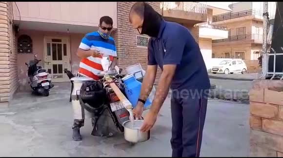 Indian man uses social distancing 'milk gun' to serve customers - Buy ...