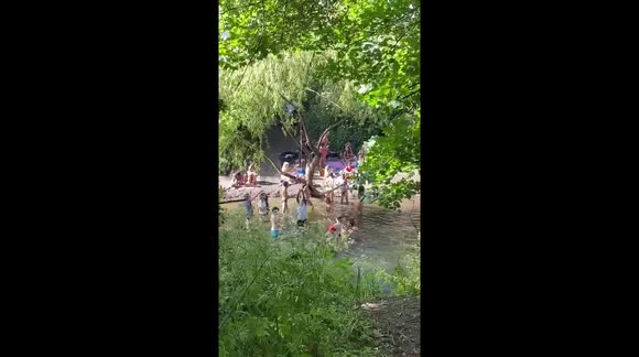 Sunseekers test social distancing by swimming in London's Hackney ...