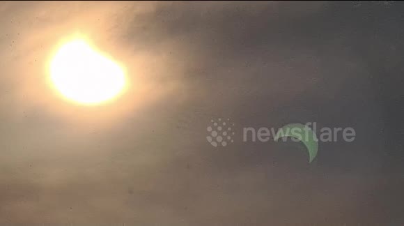 Solar eclipse with sun halo while raining - Buy, Sell or Upload Video ...