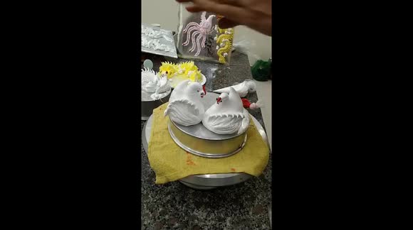 Talented baker pipes edible swans from whipped cream - Buy, Sell or ...