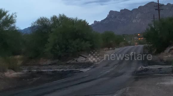 Flash flooding in Tucson, Arizona. The waters are black with soot and ...