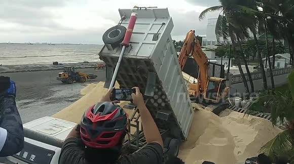 Hundreds of tonnes of artificial sand used to cover polluted beach in ...