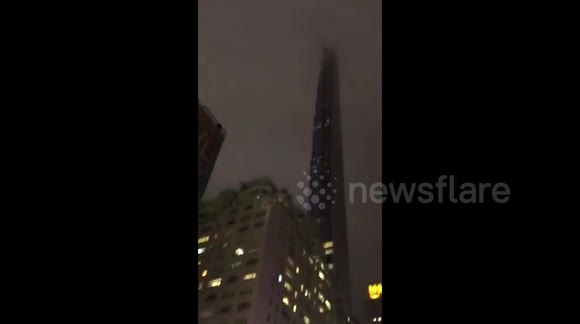 Debris falls from New York skyscraper as winds spin crane around - Buy ...