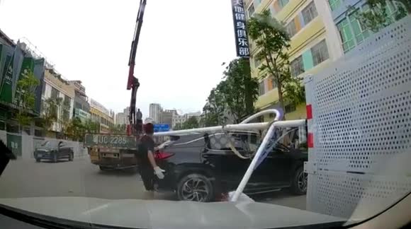 Chinese man luckily survives after lamp post falls from crane and ...
