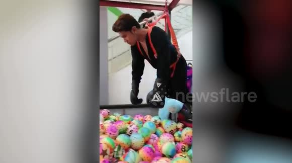 Employees turned into human "claw grabbers" at office party - Buy, Sell ...