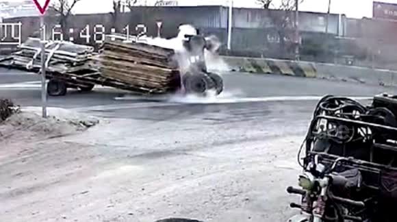 Tractor flips over backward on Chinese road after technical malfunction ...