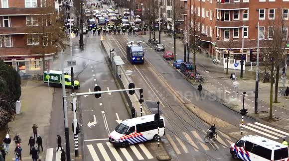 Dutch police fire water cannon at anti-lockdown protesters in Amsterdam ...