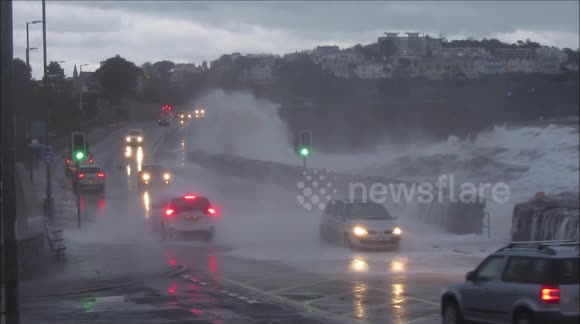 Waves crash over sea wall in Torbay in Devon as severe winter weather ...