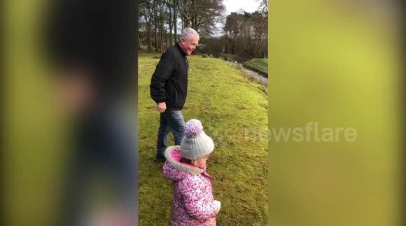 Dad's epic fail as he attempts to leap over stream after daughters bet ...