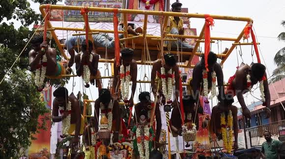 Hindu devotees endure skin-stretching pain after hanging from body ...