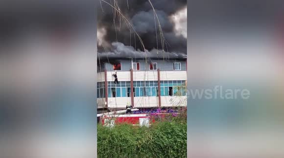 Chinese man jumps from second-floor window to escape burning building ...