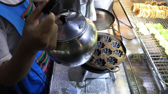 Thai baker shows process of making cannabis cakes on his street food ...