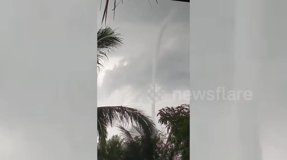 Long waterspout forms near homes in the Philippines - Buy, Sell or ...